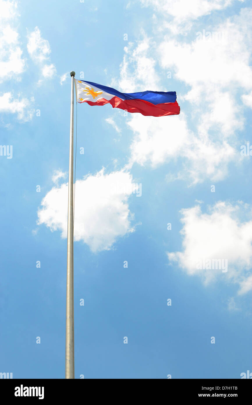 flag of Philippines at luneta, rizal park waving against blue sky ...