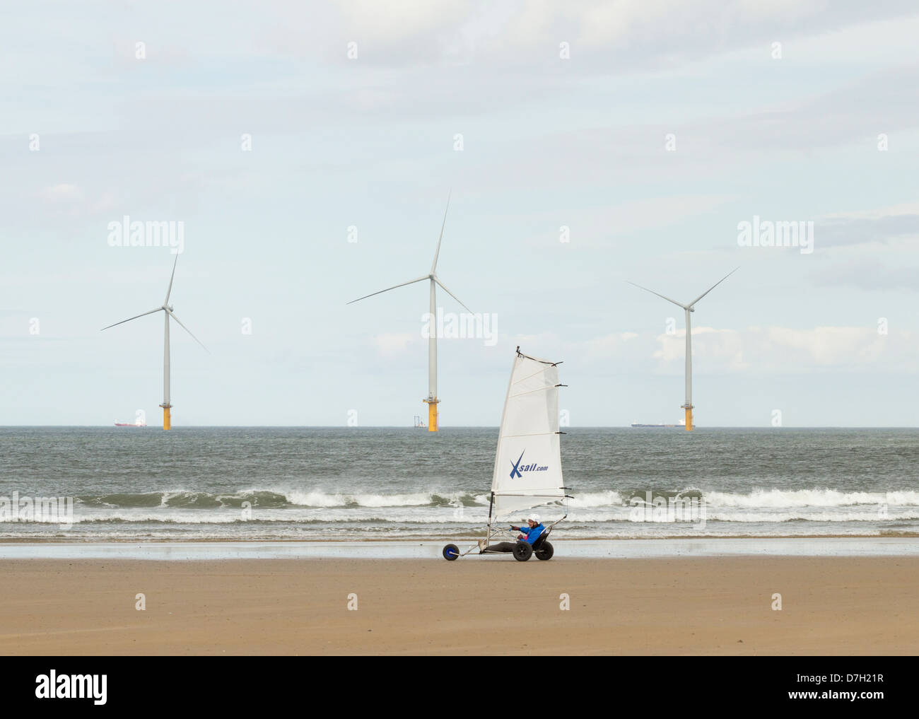 Land Sailing on Redcar beach with offshore wind turbines in background ...