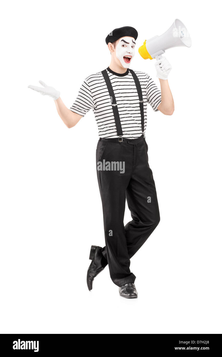 Full length portrait of a male mime artist speaking at loudspeaker and ...