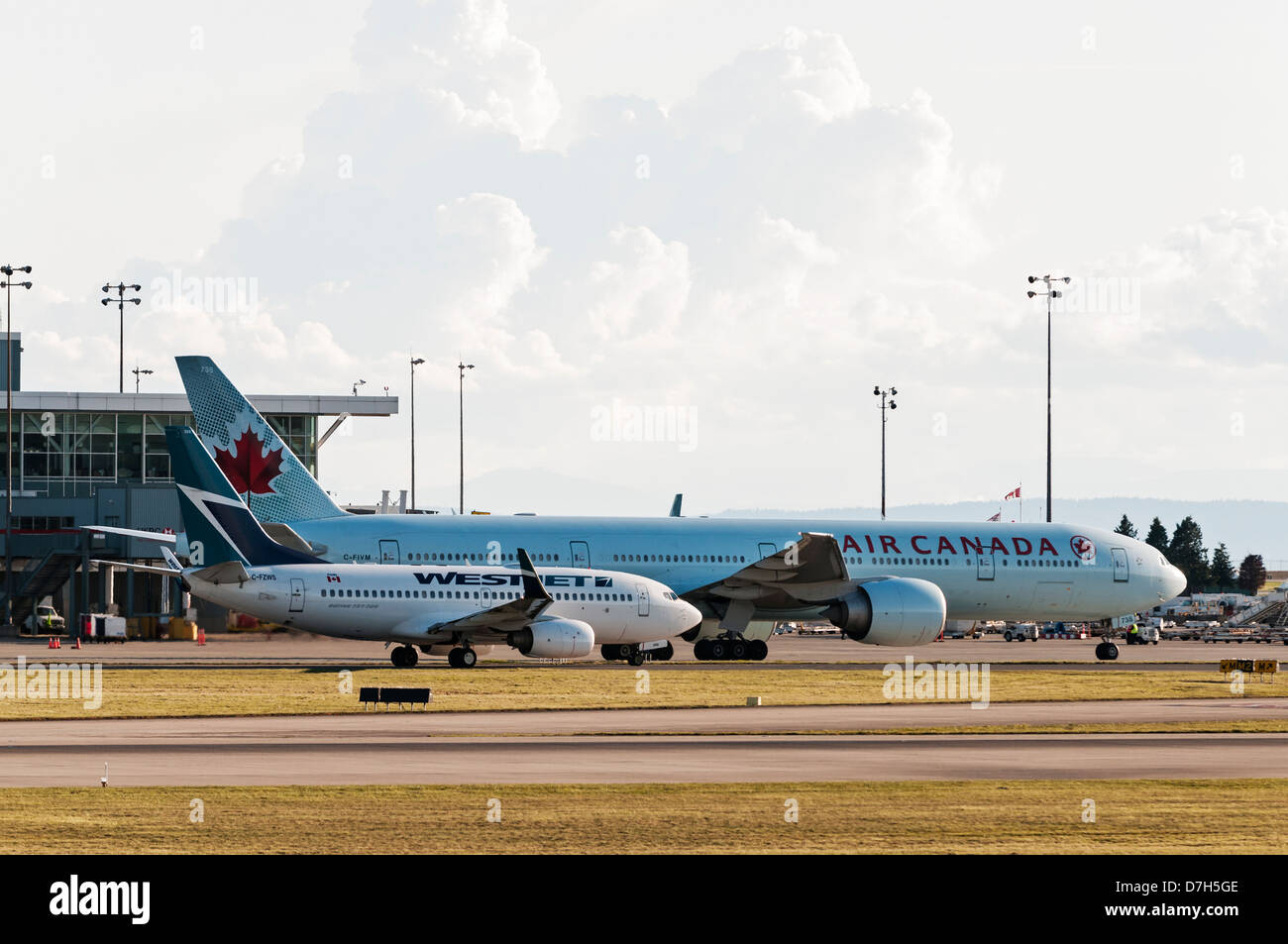 Canadian airline competition: a Westjet Boeing 737 taxies by an Air ...