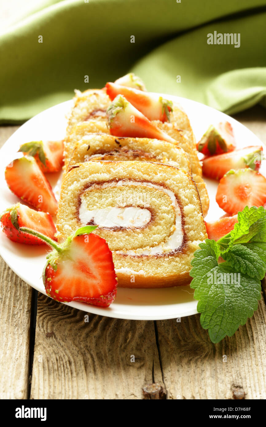roulade cake with cream and fresh strawberries Stock Photo - Alamy