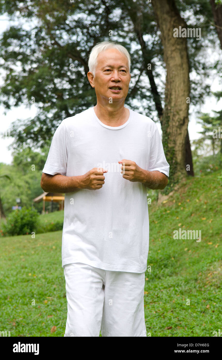 Asian senior male jogging hi-res stock photography and images - Alamy