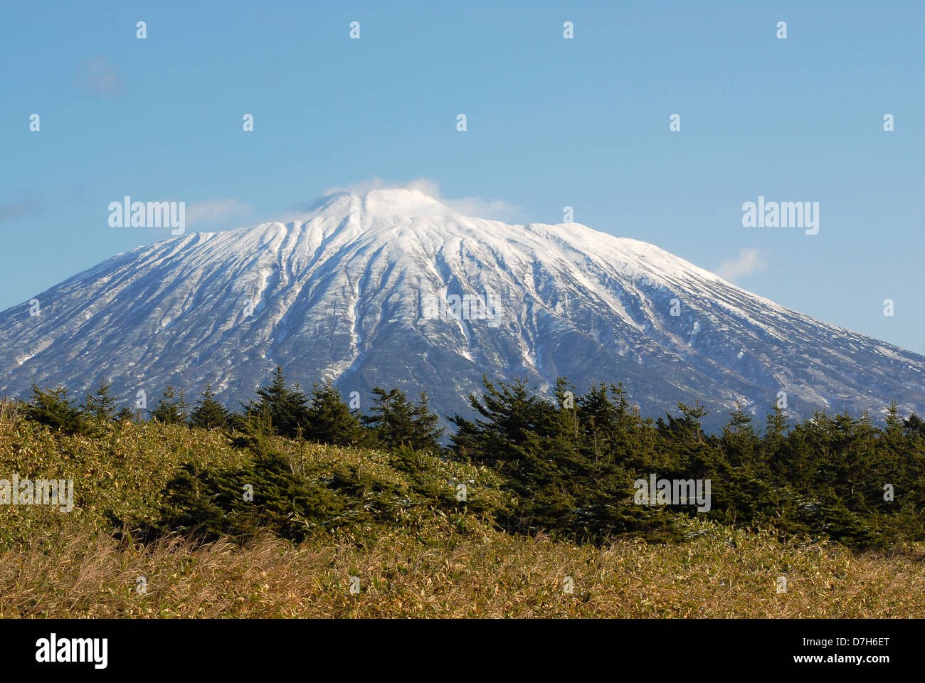 Fresh snow on Tiatia Volcano at the Pacific ocean coast on the Kunashir ...