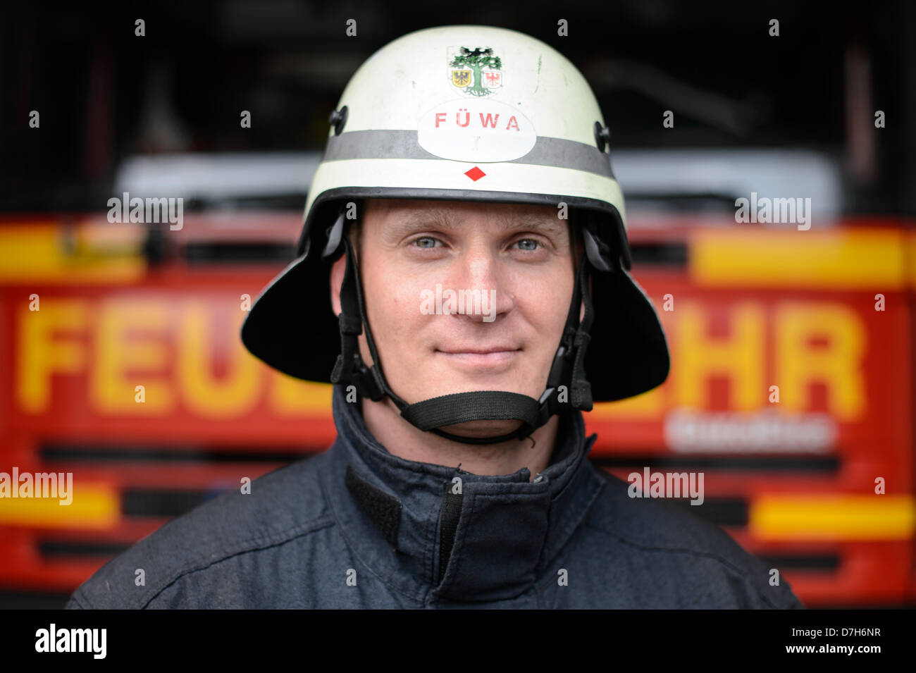 Fireman Danny Oppermann stands before a fire truck. Photo: Robert ...
