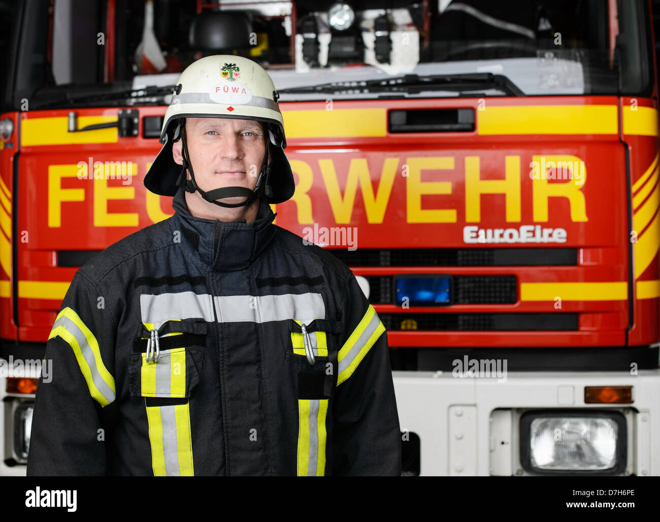 Fireman Danny Oppermann stands before a fire truck. Photo: Robert ...
