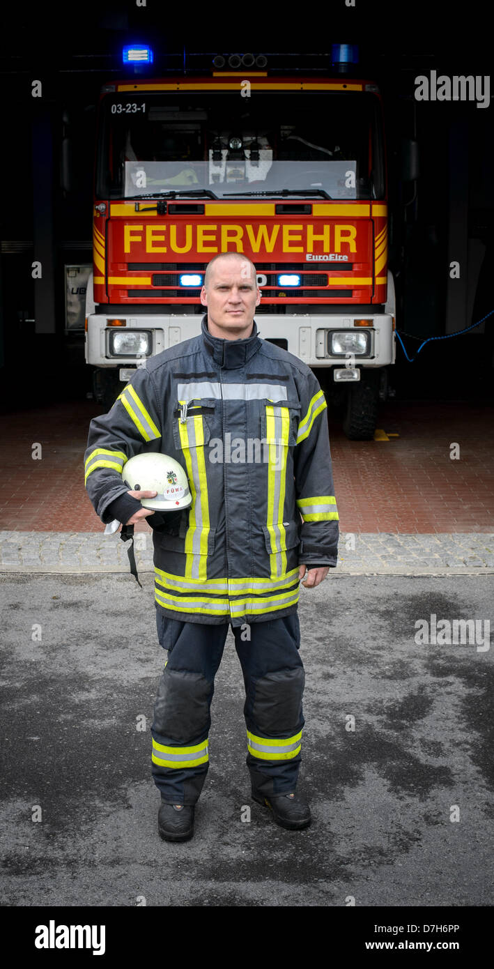 Fireman Danny Oppermann stands before a fire truck. Photo: Robert ...