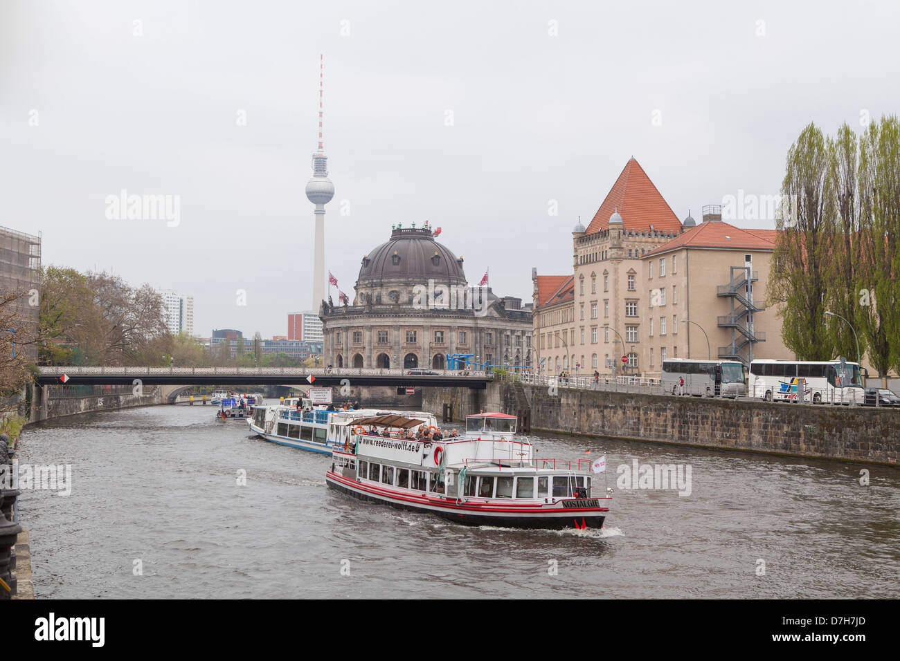 Canal boat at the river Spree with the televison tower of the former ...