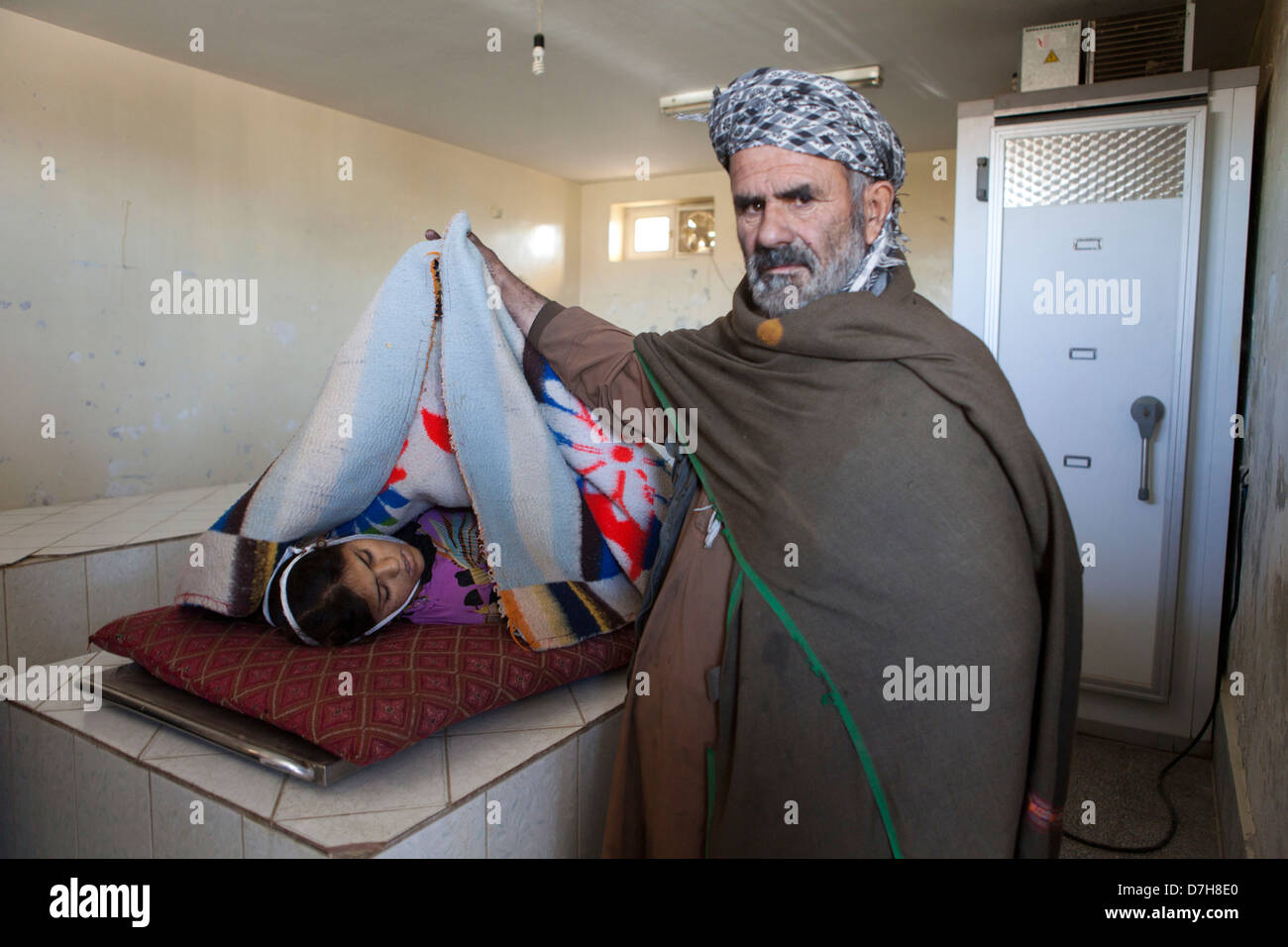 father next to his dead daughter (she was killed by unknown people) in ...