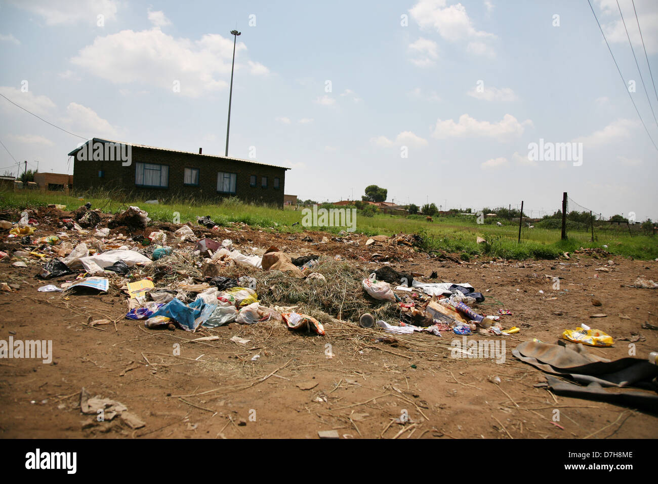 Garbage litters the side of the road in a rural community Stock Photo ...