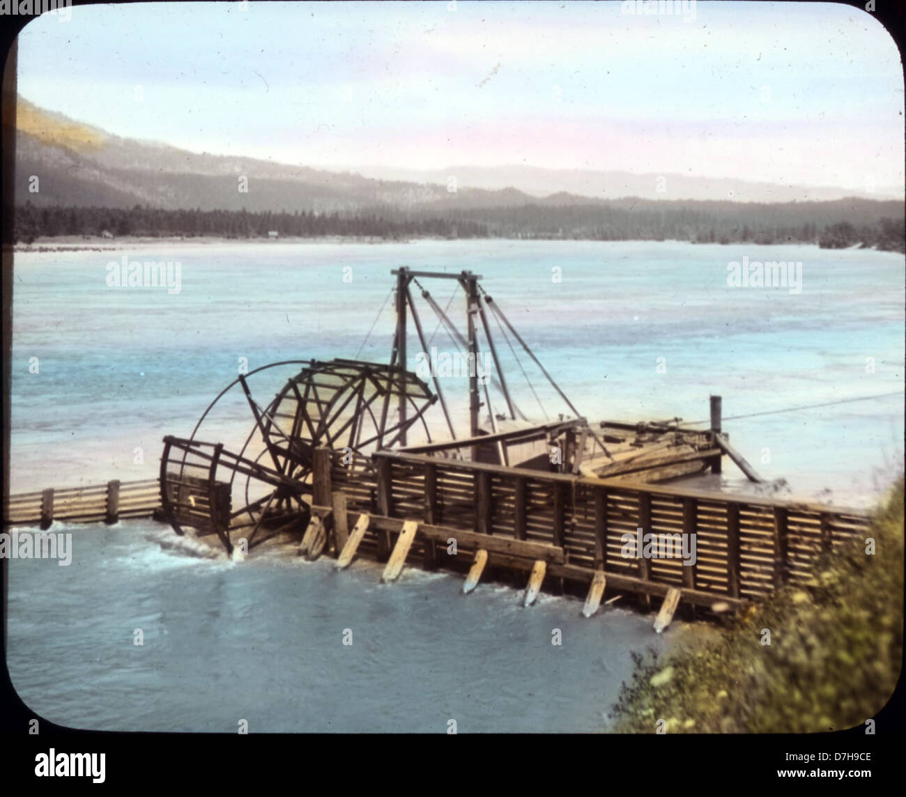 This early 20th-century photograph depicts a fish wheel, an industrial ...