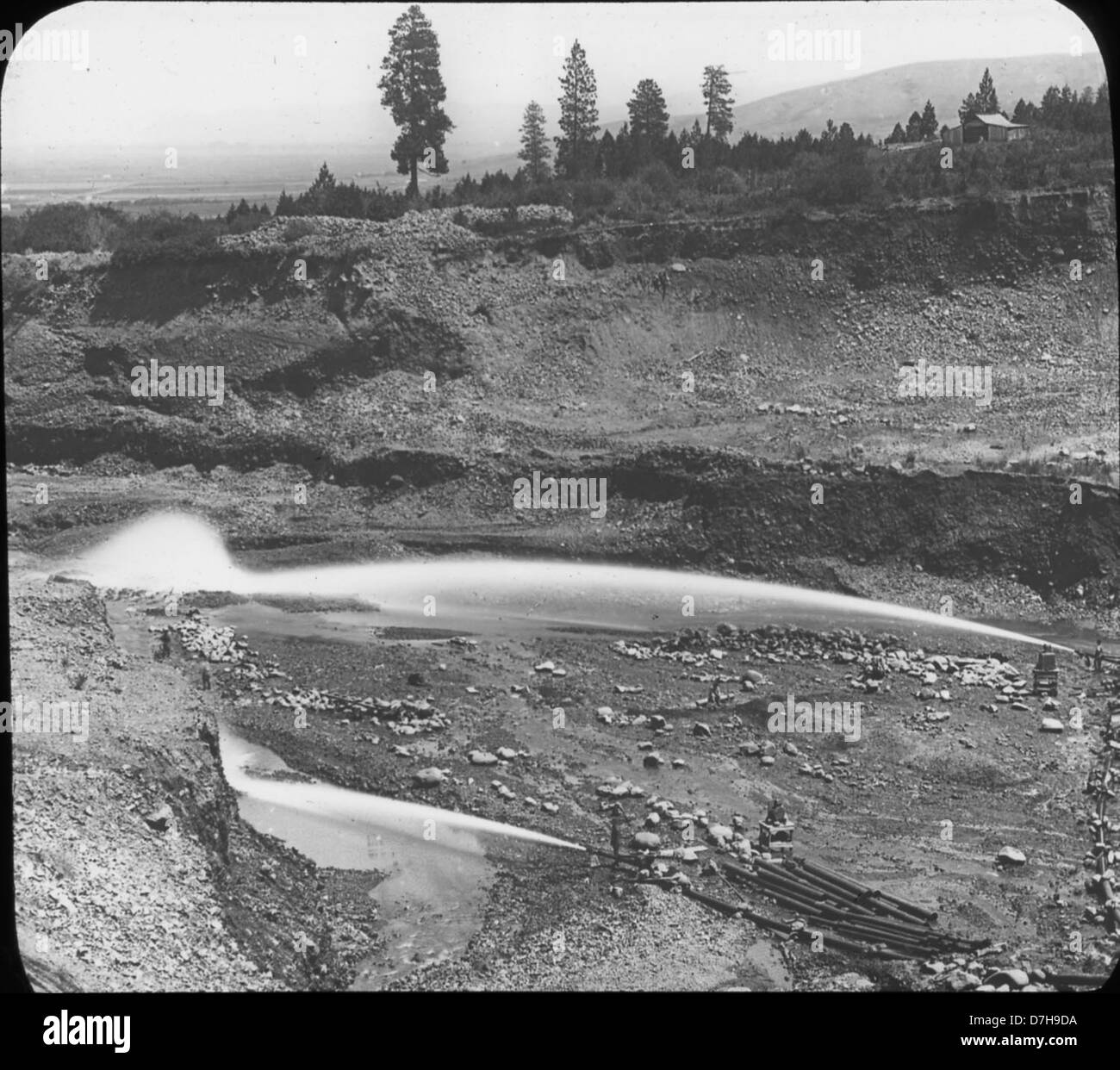 The image captures a scene of placer mining in Oregon between 1905 and ...