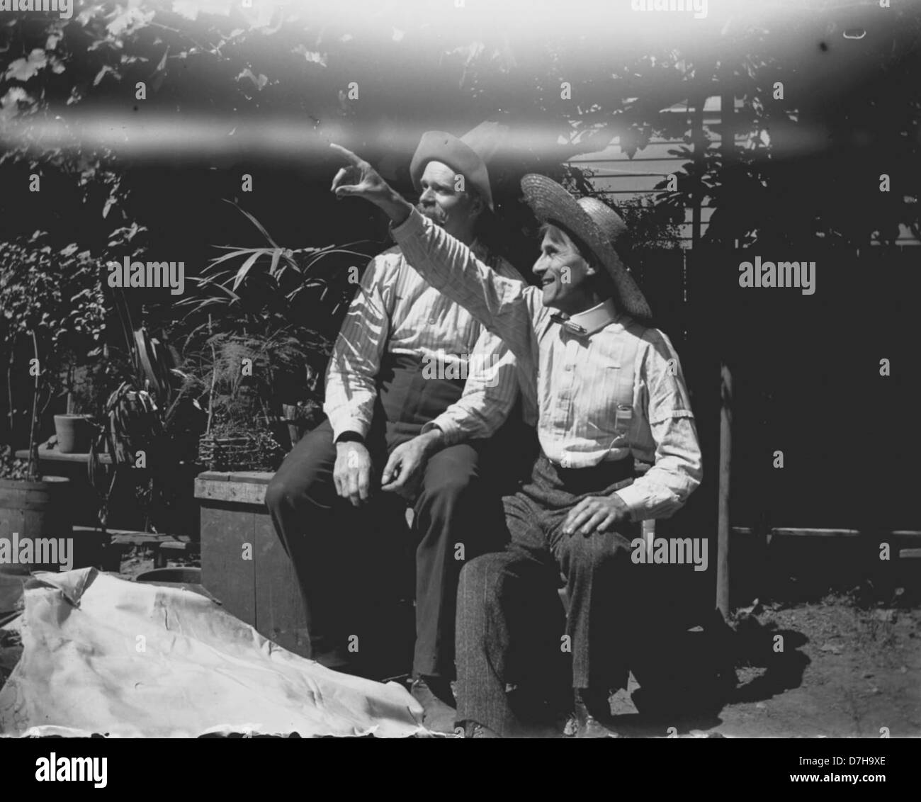 Herman Bohlman and William L. Finley are pictured sitting in a garden ...