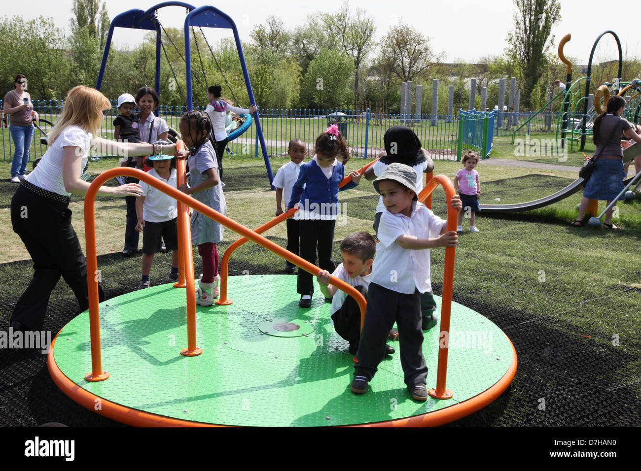 Multicultural Kids Playing On Playground