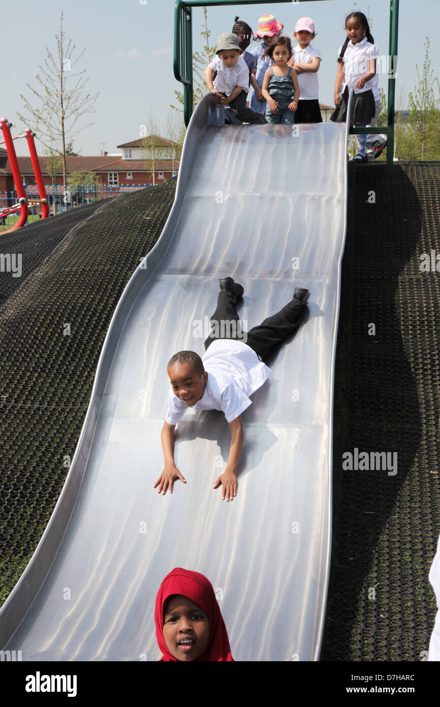 Kids playing on playground in hi-res stock photography and images - Alamy