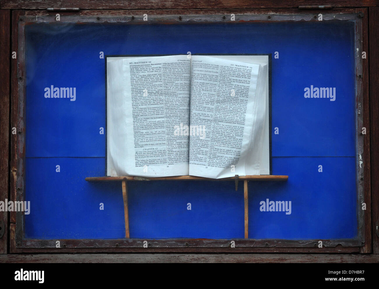 A bible is pictured in a window built into a church wall Stock Photo ...