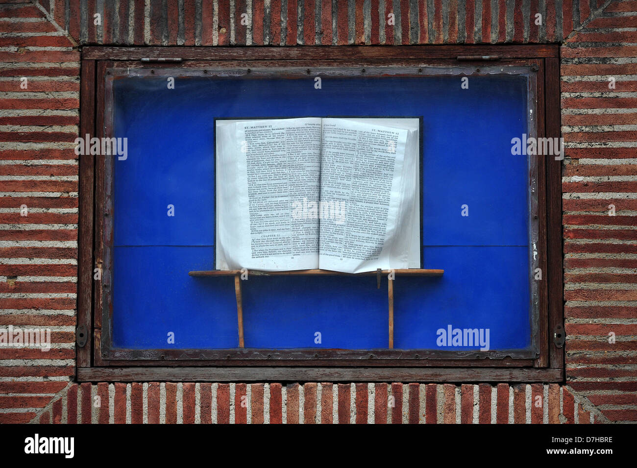 A bible is pictured in a window built into a church wall Stock Photo ...