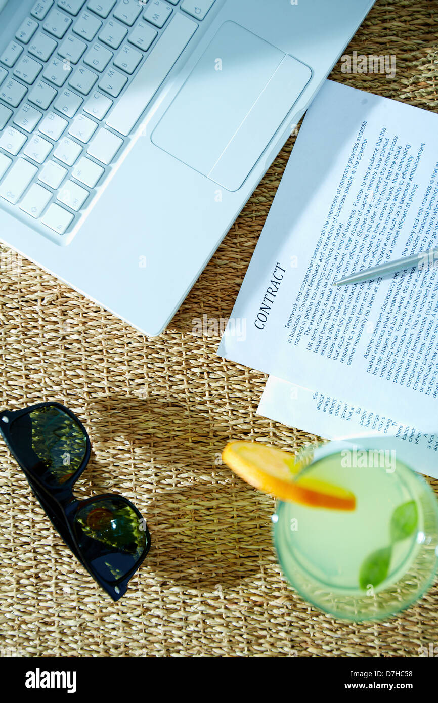 Image of business contract with pen, laptop, cocktail and sunglasses ...