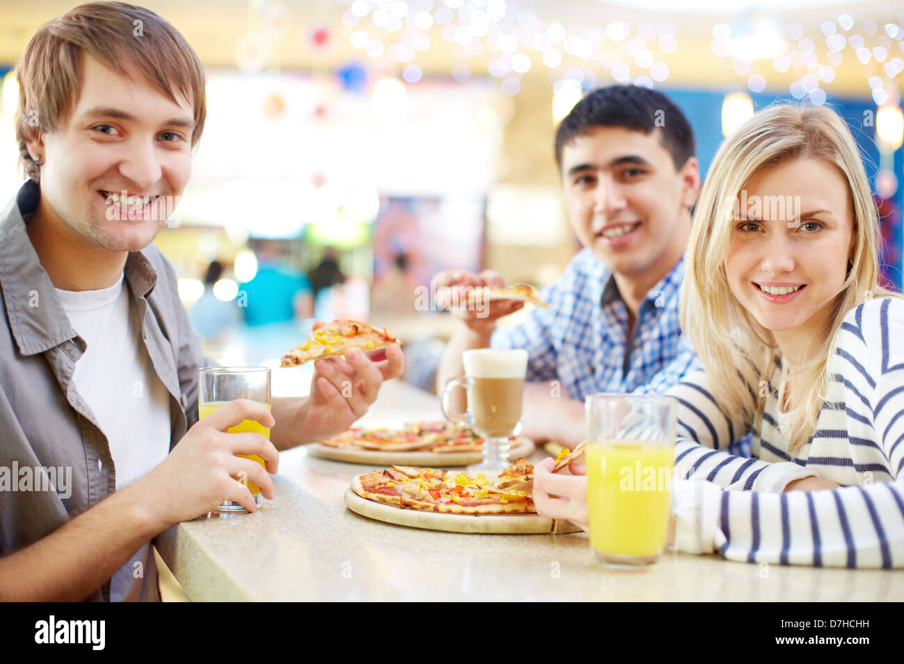 Image of teenage friends having snack in cafe Stock Photo - Alamy