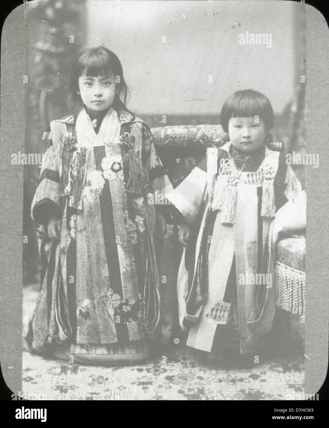 A photograph of two Japanese children, capturing a moment of cultural ...