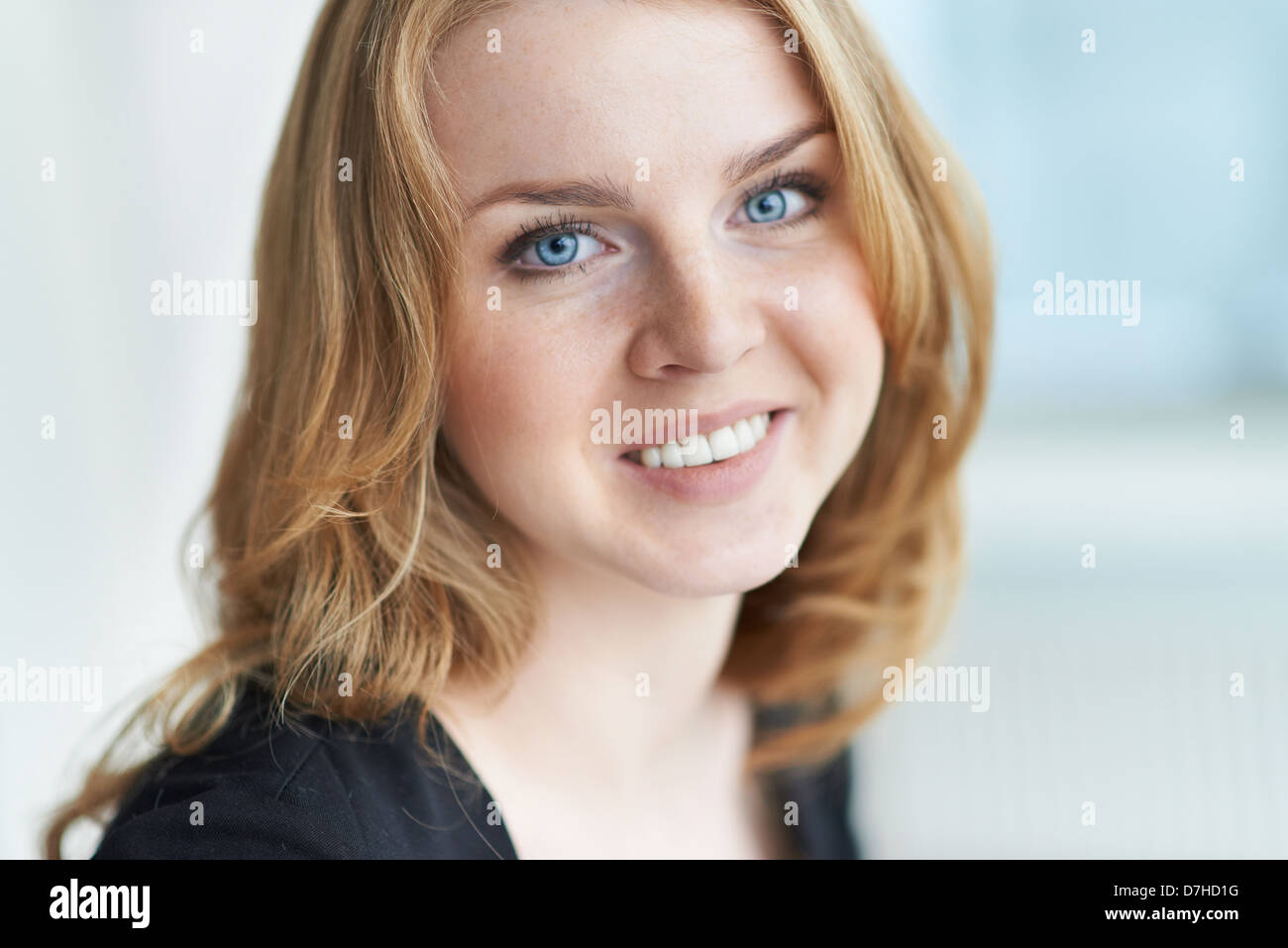 Face of lovely girl looking at camera with smile Stock Photo - Alamy