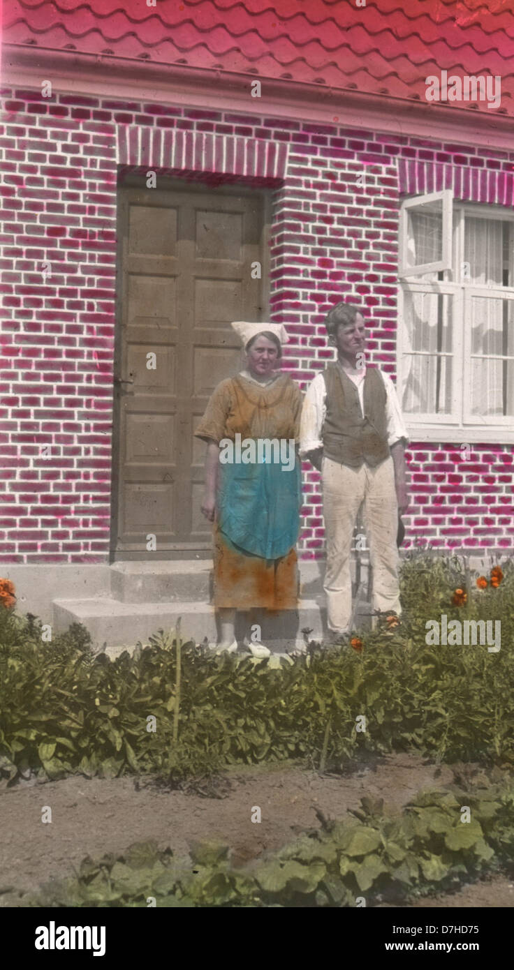 A historical photograph captures a young farm man and woman in Denmark ...