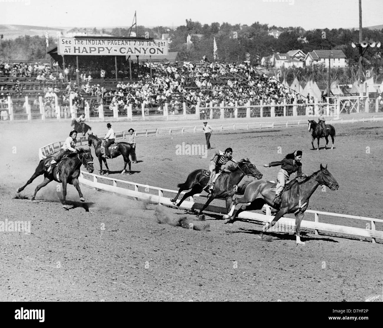 This photograph captures Indian women racing on horseback, likely taken ...