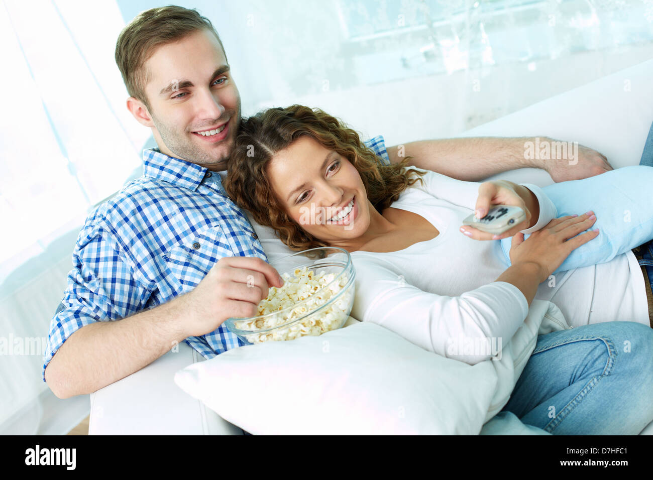 Husband and wife resting bonding at home enjoying weekend hi-res stock ...