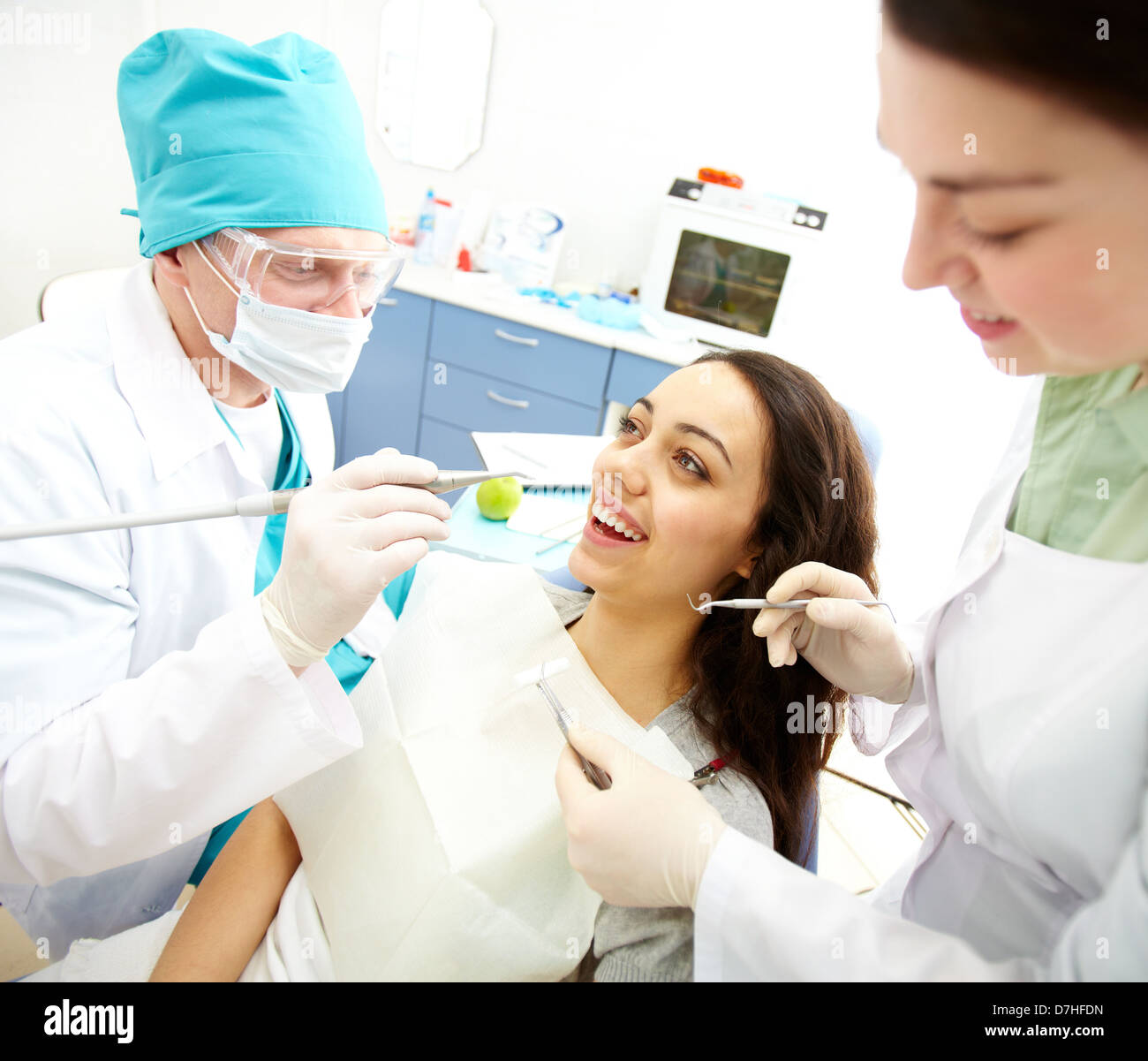 Pretty girl sitting at the dentist’s and having mouth checkup Stock ...