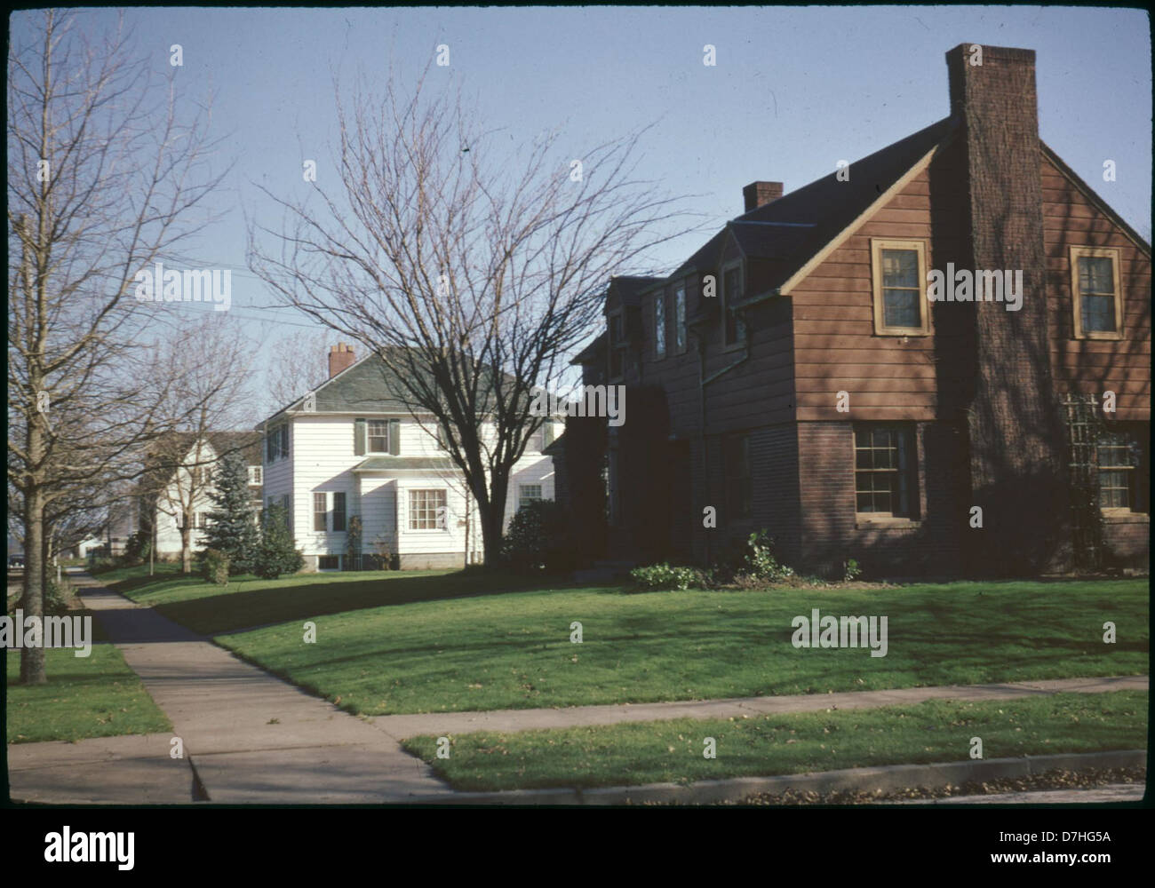 This image shows a suburban neighborhood with neatly arranged homes and ...