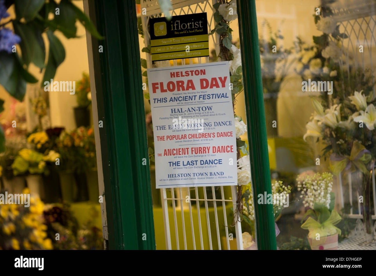 Helston Flora Day 2013, Decorated shop with Flora day advert in window ...
