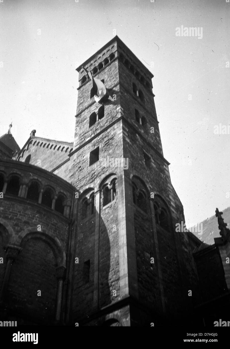 This photograph shows the bell tower of a cathedral in post-WWII ...
