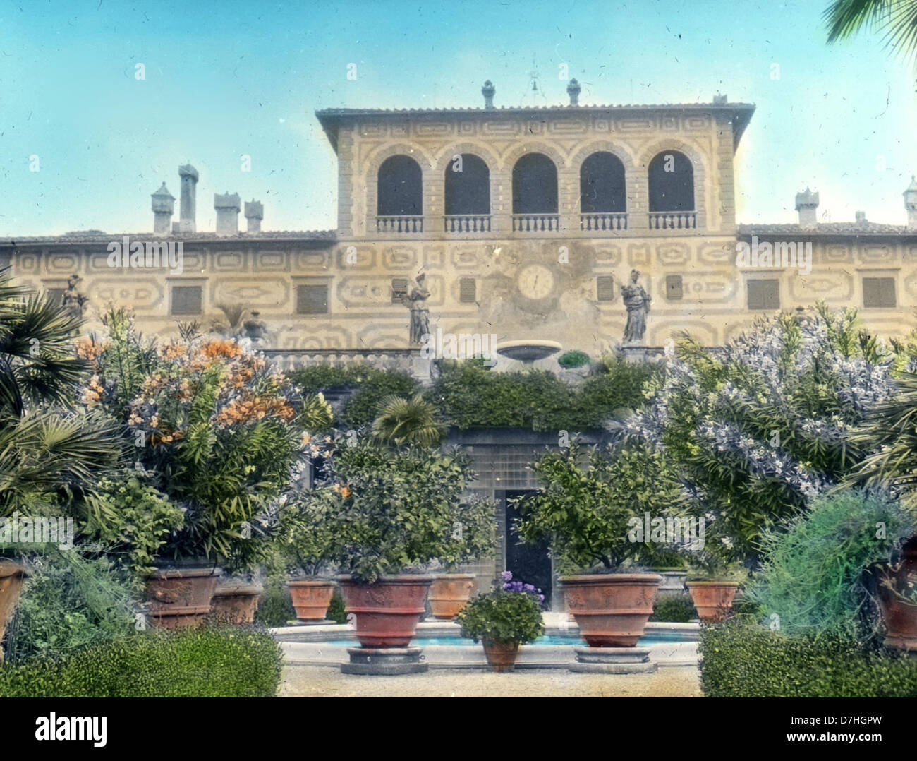This photograph captures a terrace in Florence, Italy, framed by lush ...