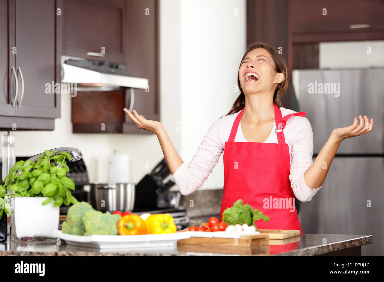 Funny cooking image of woman crying and screaming in kitchen giving up ...