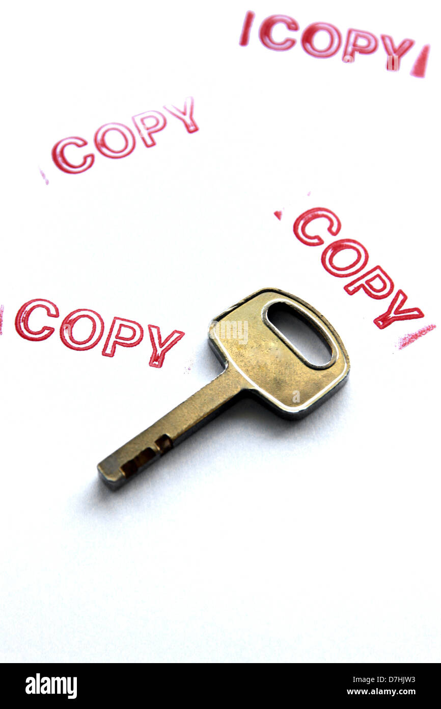 Key placed on a white background with text written on Copy Stock Photo ...