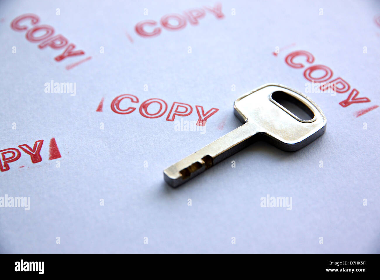 Key placed on a white background with text written on Copy Stock Photo ...