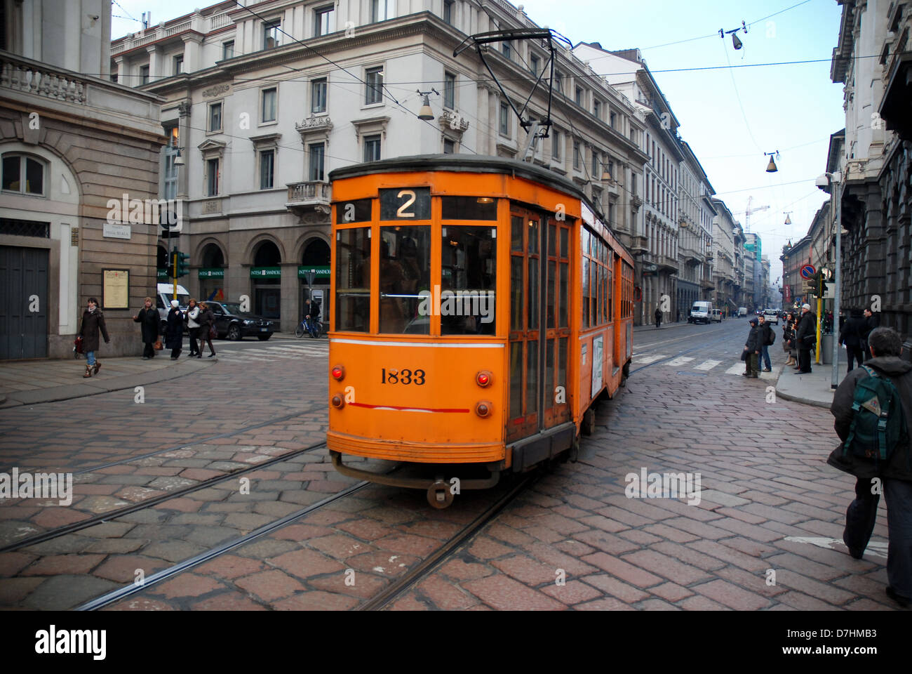 traditional yellow/orange tram in the streets of Milan, italy Stock ...