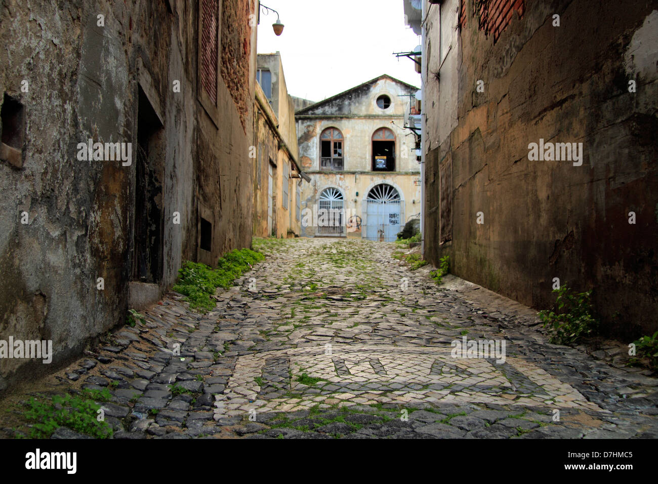 Narrow cobbled alley, run-down building, Lisbon, Portugal Stock Photo ...