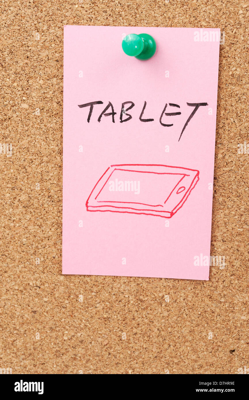 Tablet word and symbol drawn on paper and pinned on cork board Stock ...