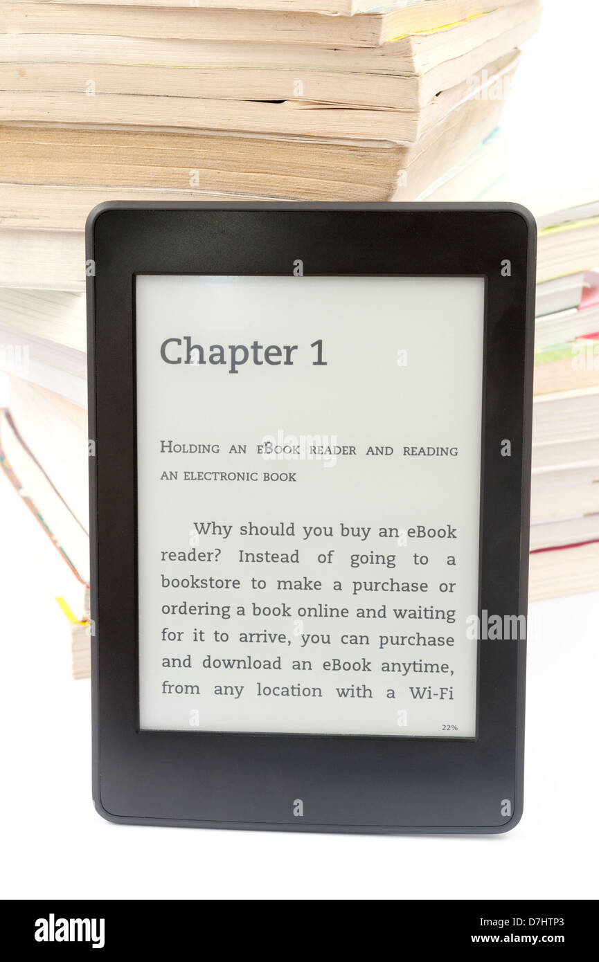 E-book reader leaning against pile of books Stock Photo - Alamy