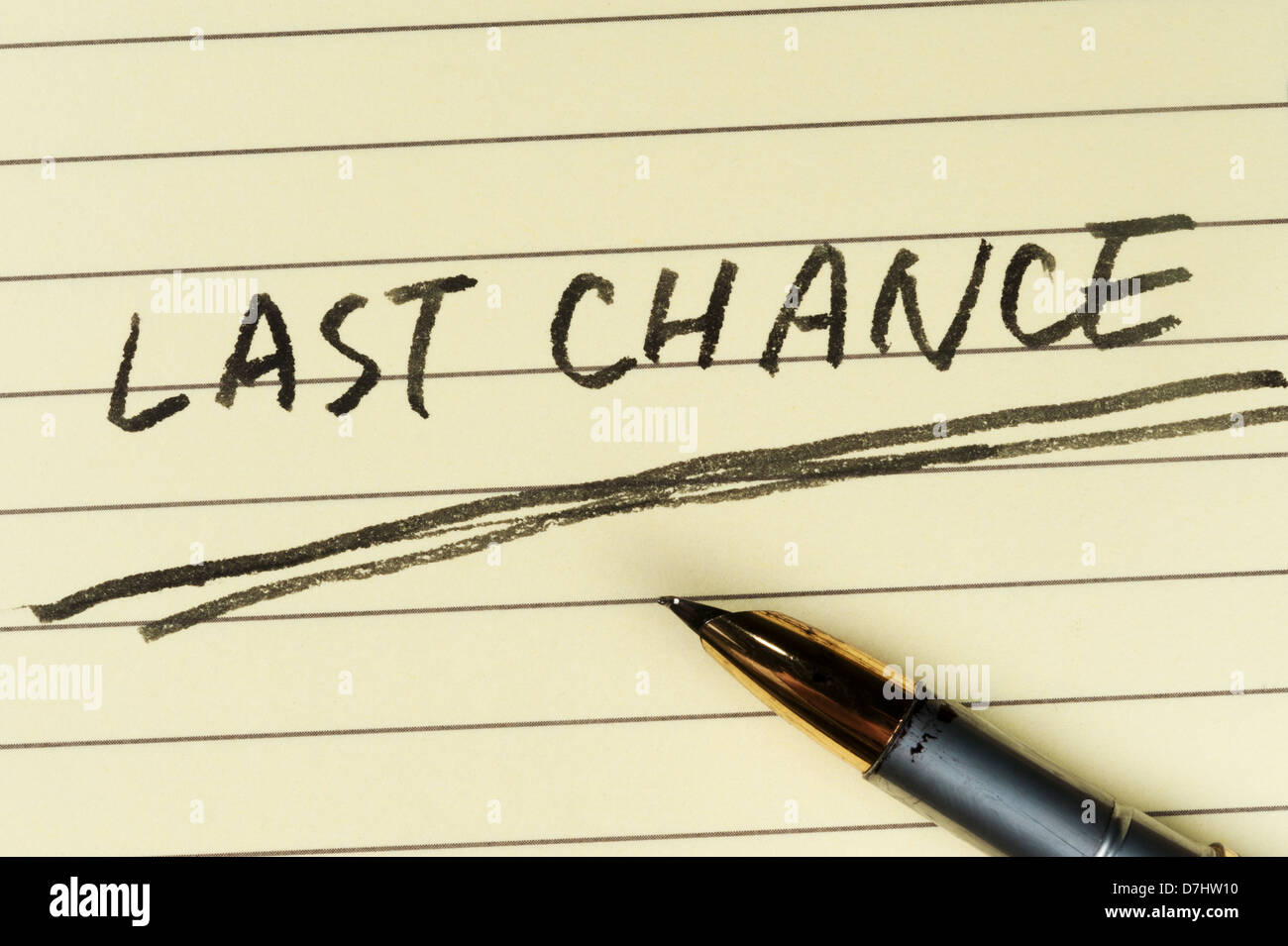 Last chance words written on lined paper with a pen on it Stock Photo ...