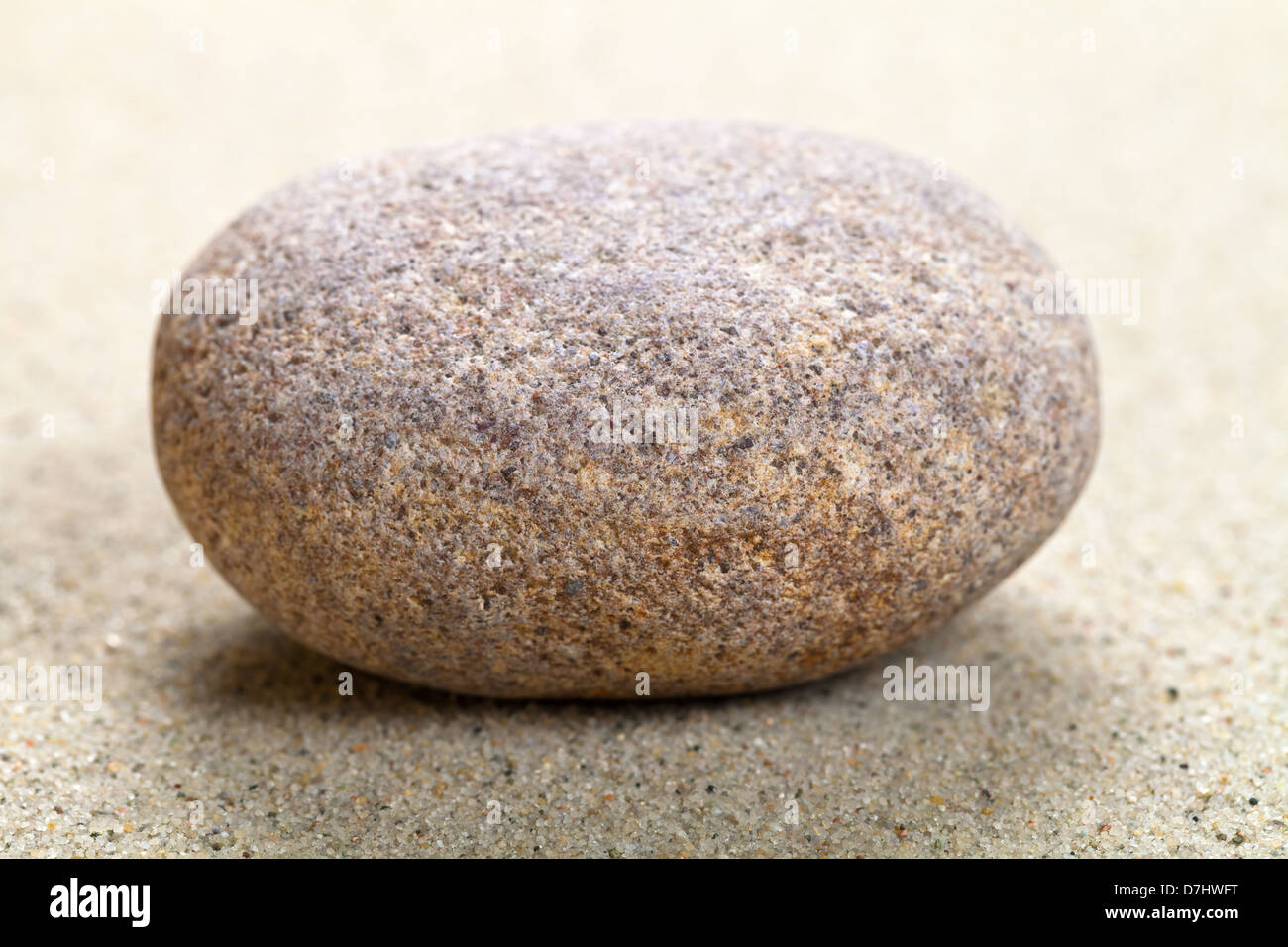 Beige stone in sand. Nature background. Macro shot Stock Photo - Alamy