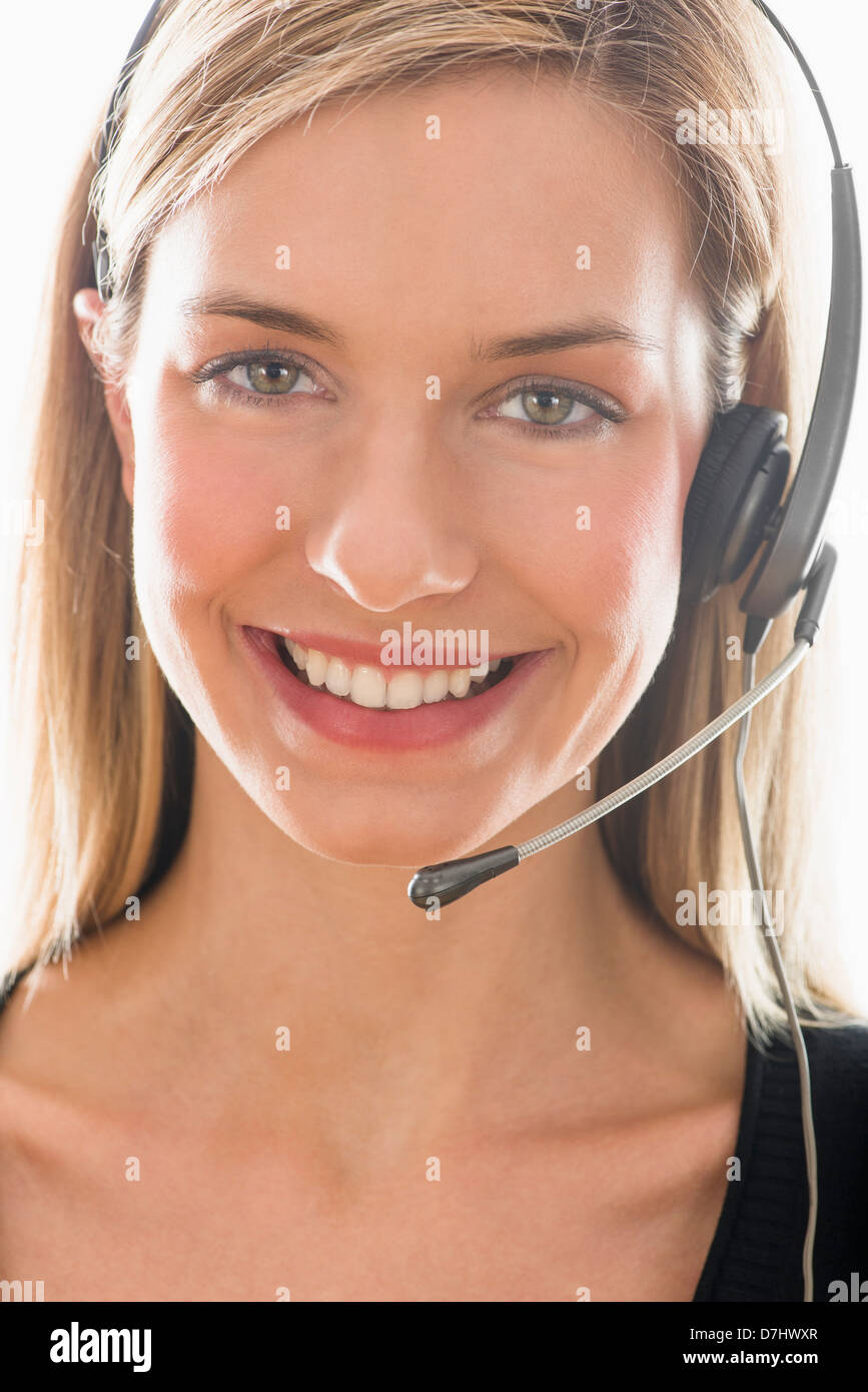 Studio portrait of young woman wearing headset Stock Photo - Alamy
