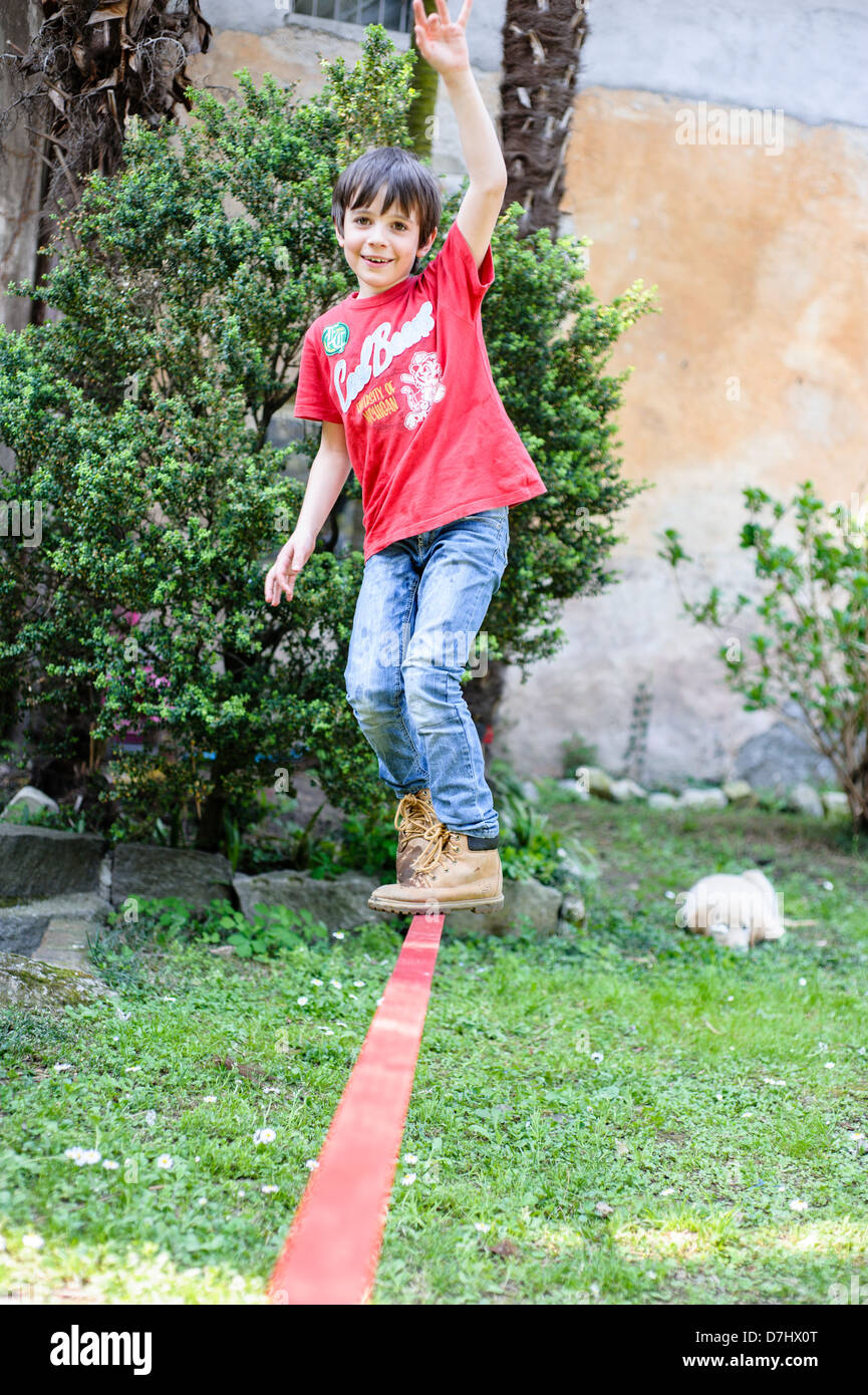 child plays on the slackline Stock Photo - Alamy