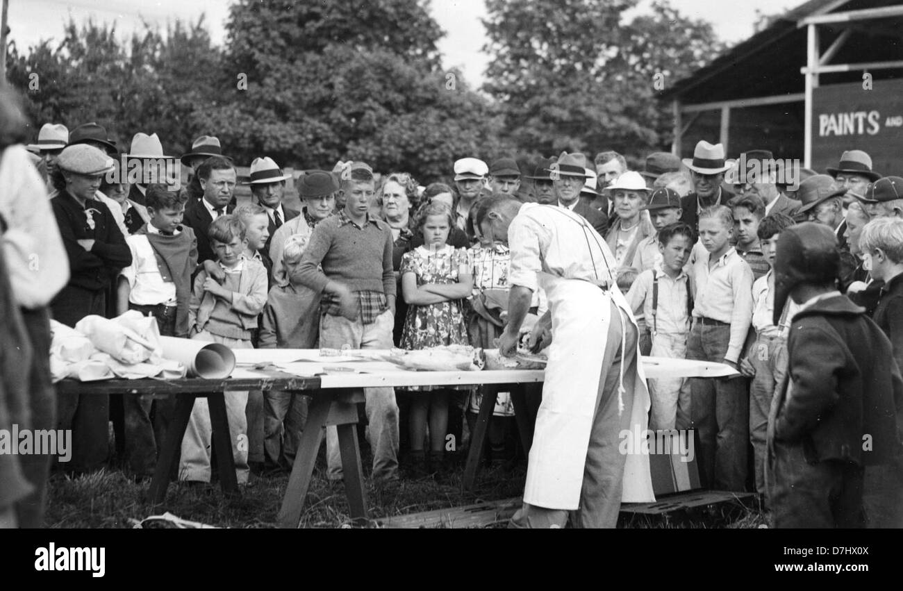 A.W. Oliver demonstrates butchering techniques in this 1938 photograph ...