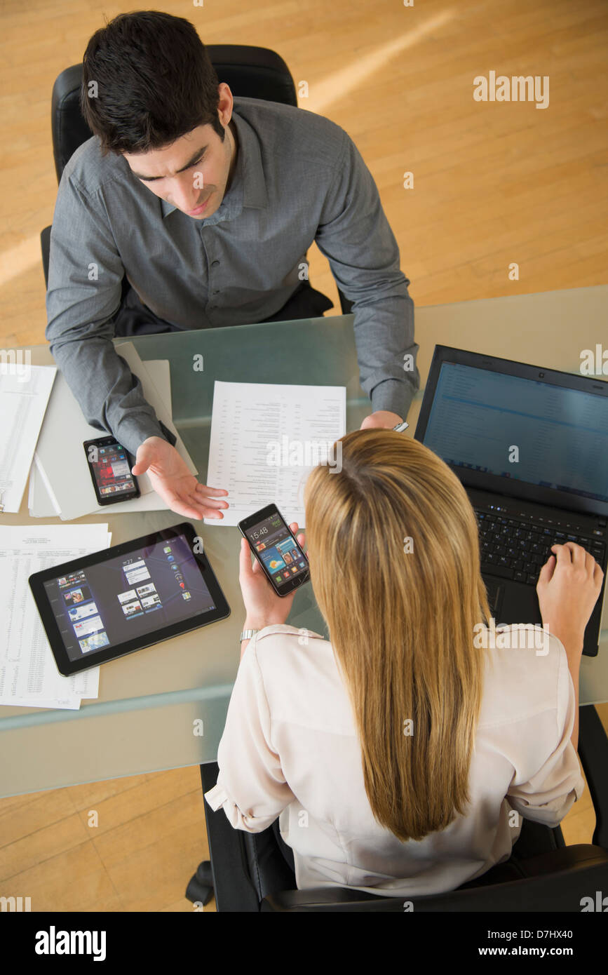 Business people using multiple digital hi-res stock photography and ...