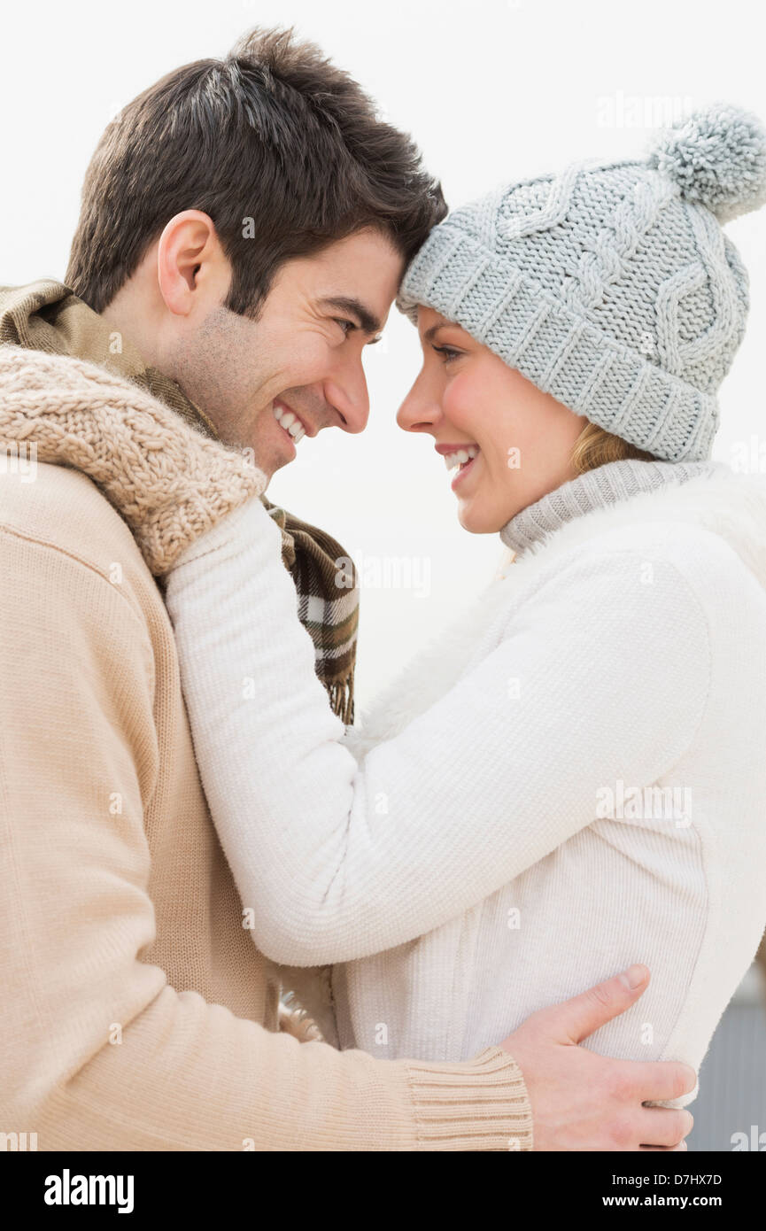 Profile of couple in winter clothing Stock Photo - Alamy