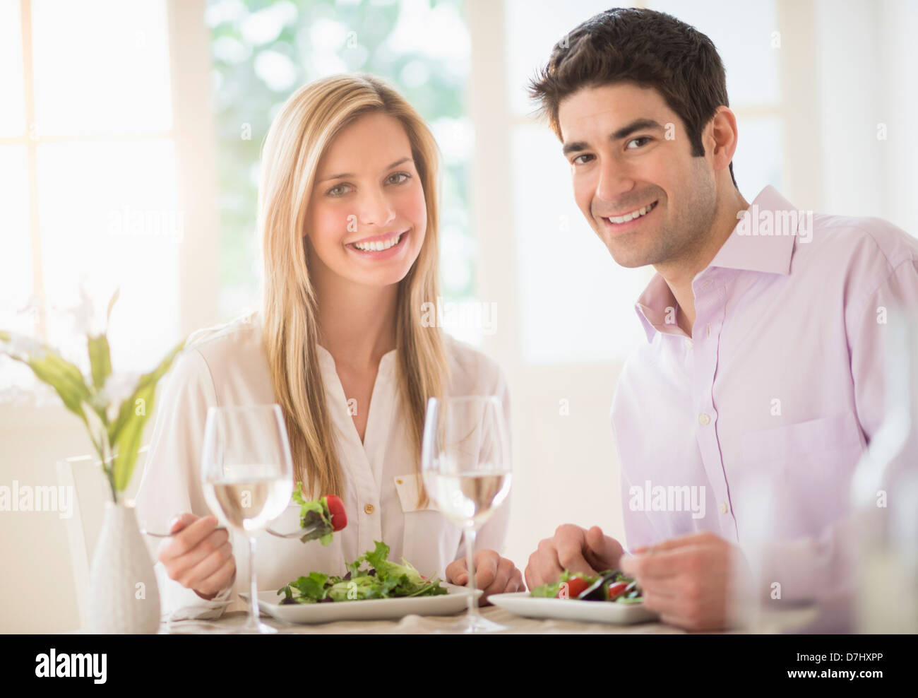 Portrait of couple eating dinner in restaurant Stock Photo - Alamy