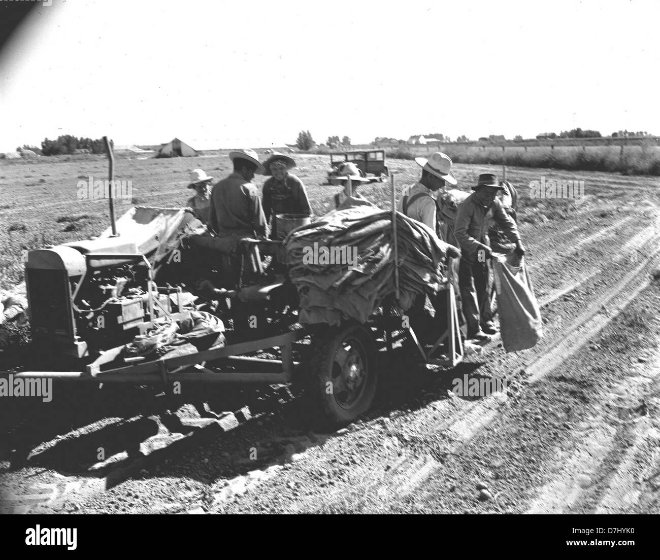 An image capturing a combine operation in agriculture, likely showing ...
