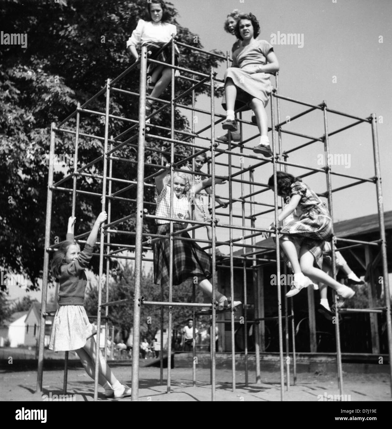 The image shows children engaging in outdoor play on a playground ...