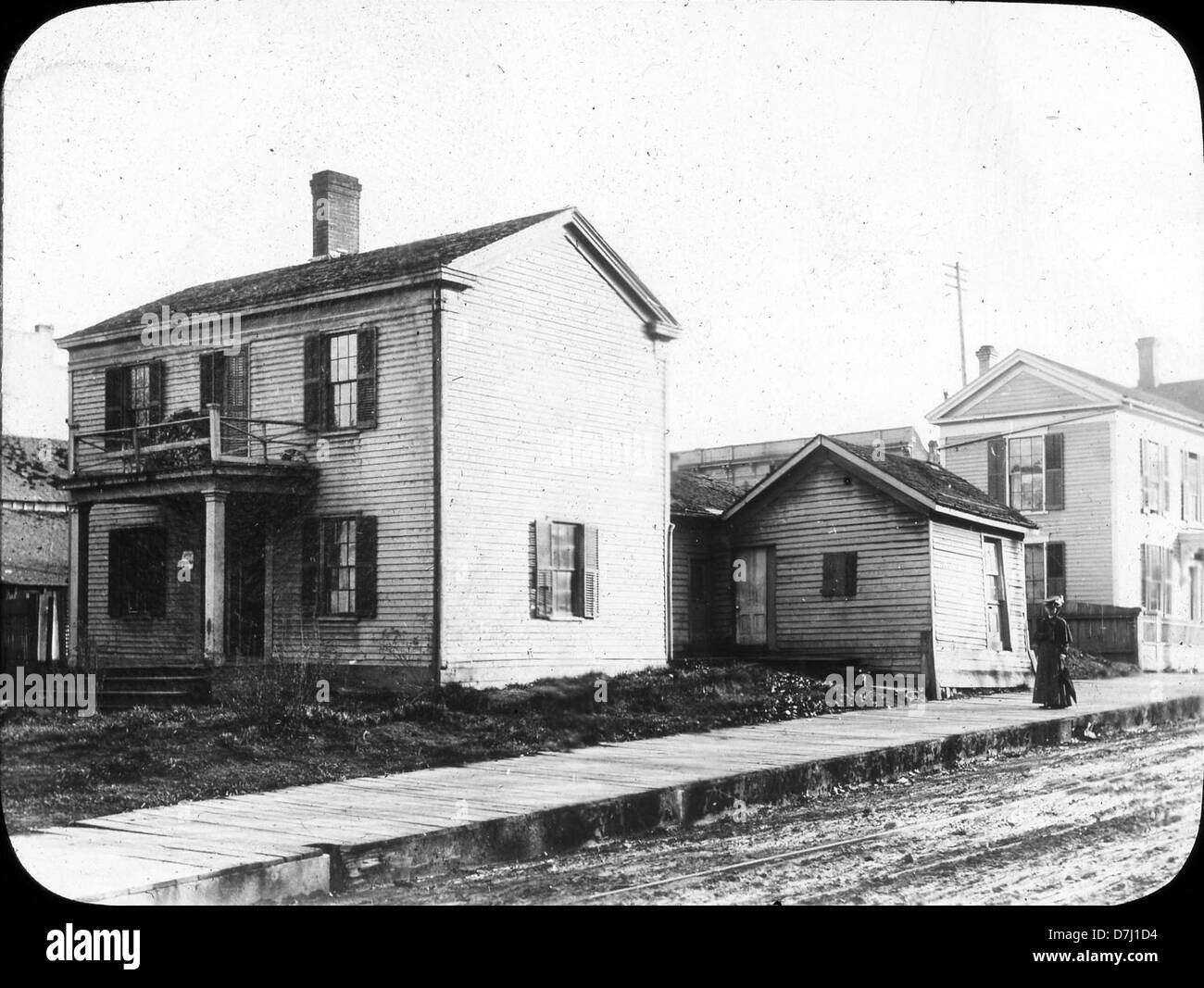 This historic photograph from circa 1850 shows people walking by a ...